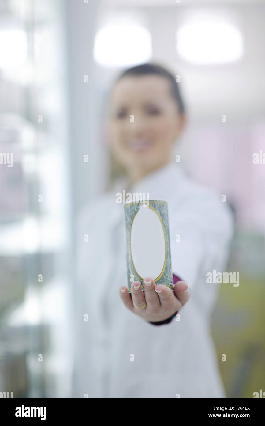 Happy cheerful pharmacist chemist woman standing in pharmacy drugstore ...