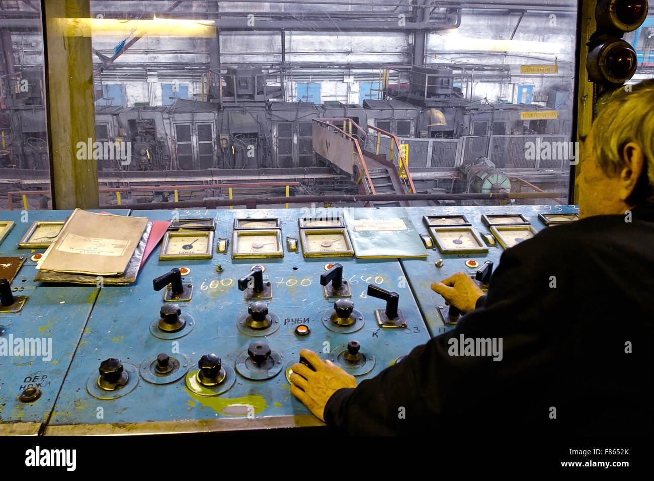Worker on factory in control room Stock Photo - Alamy