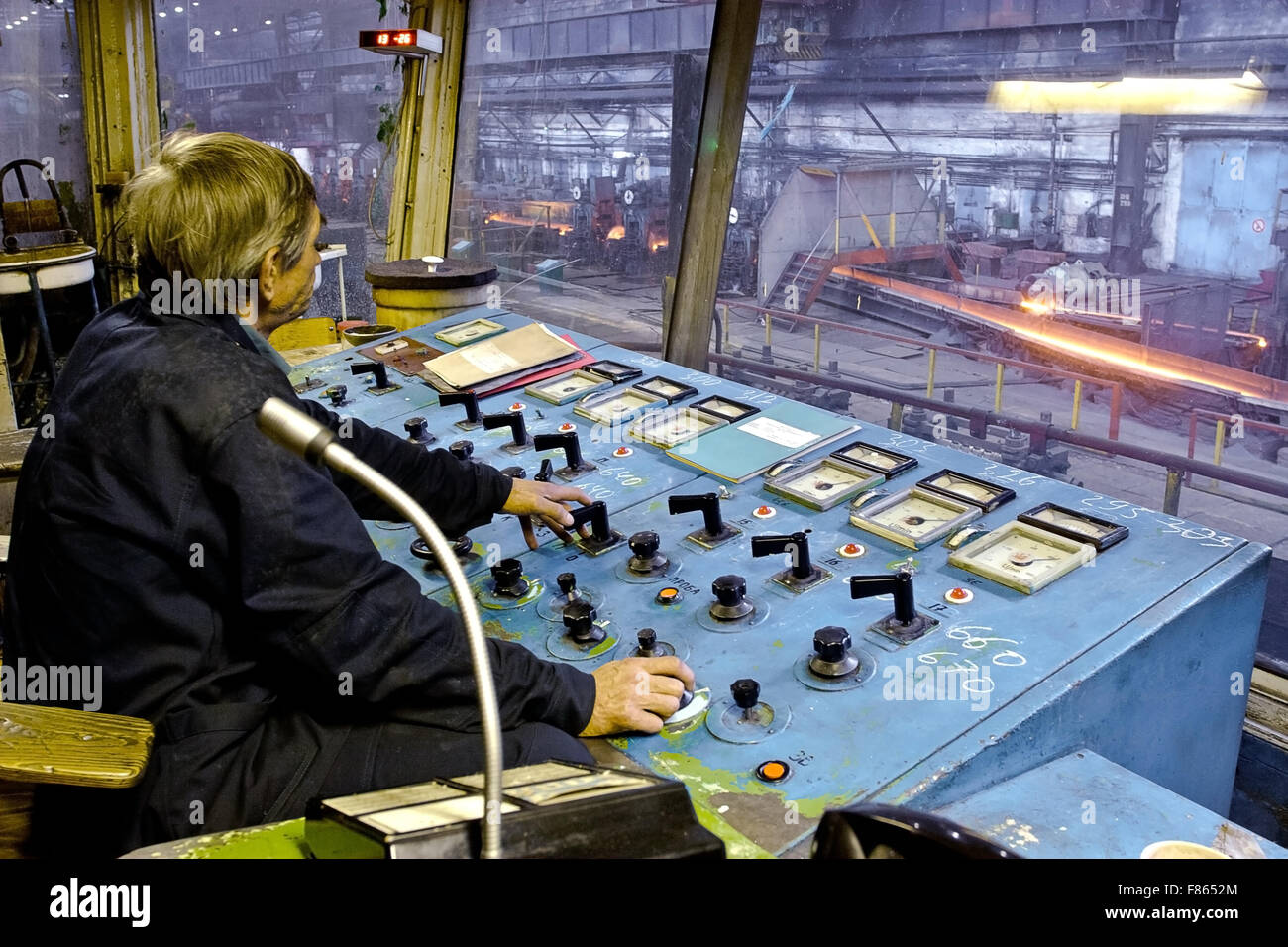 Worker on factory in control room Stock Photo - Alamy