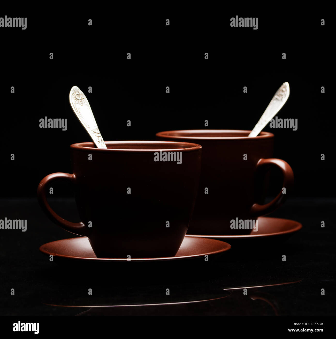 Two tea cups with teaspoons Stock Photo - Alamy