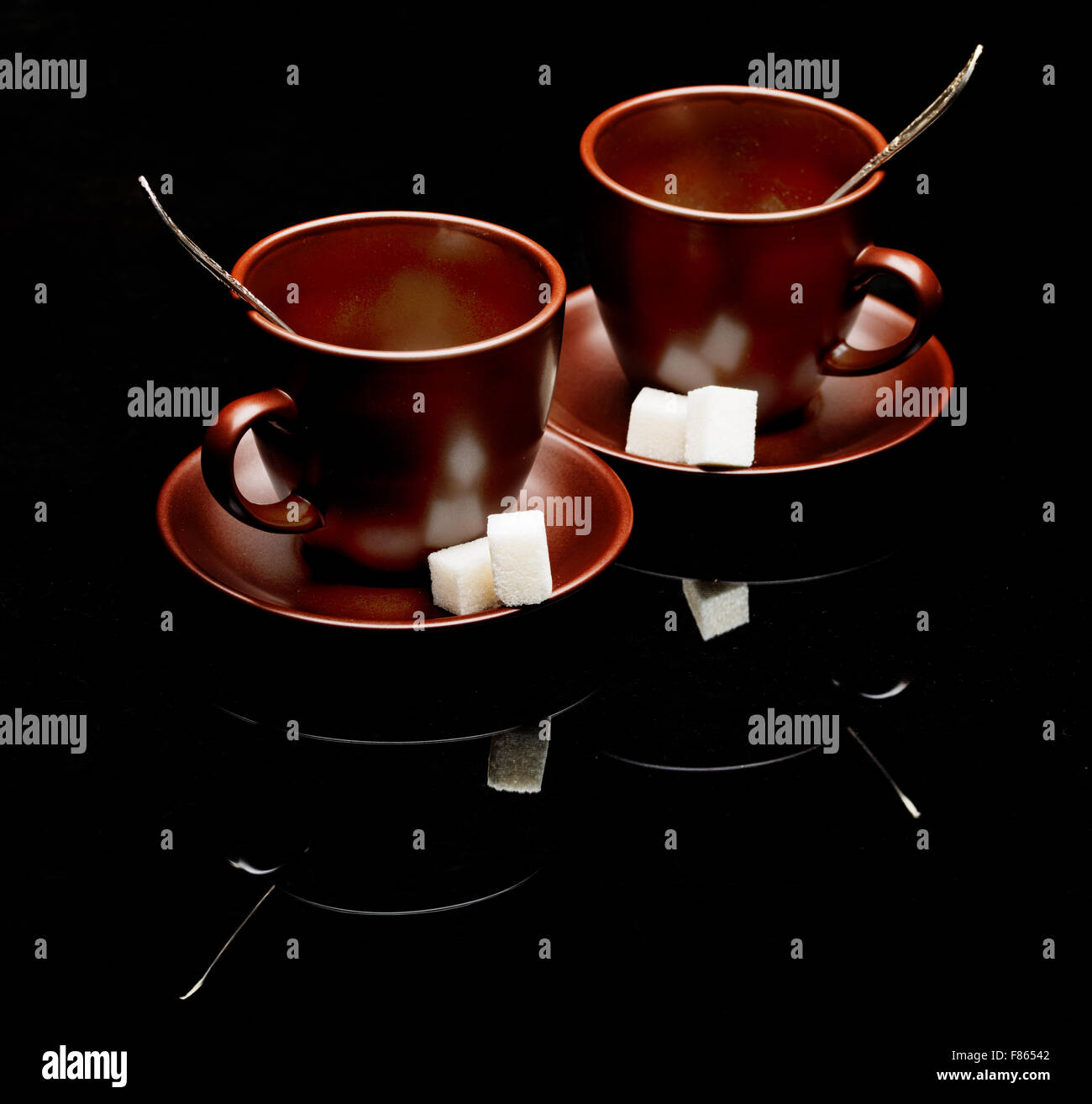 Two tea cups with teaspoons Stock Photo - Alamy