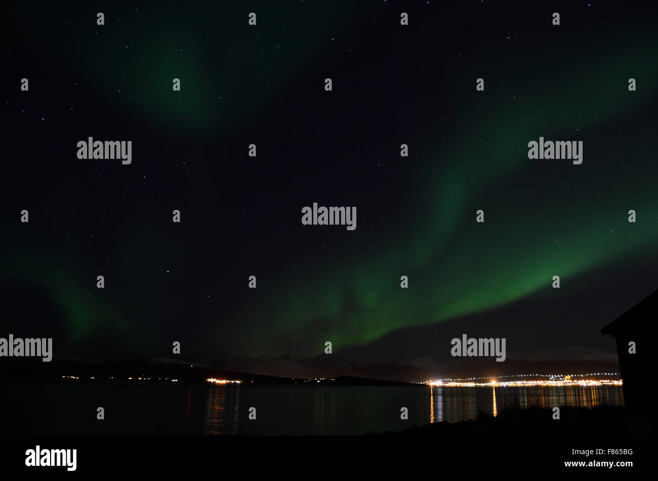 aurora borealis over cold fjord and mountain in autumn Stock Photo - Alamy