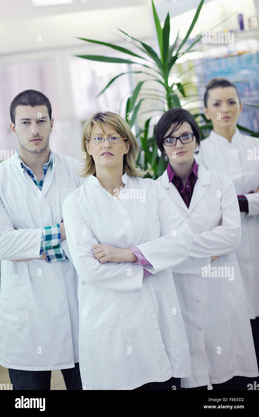 team of pharmacist chemist woman and man group standing in pharmacy ...