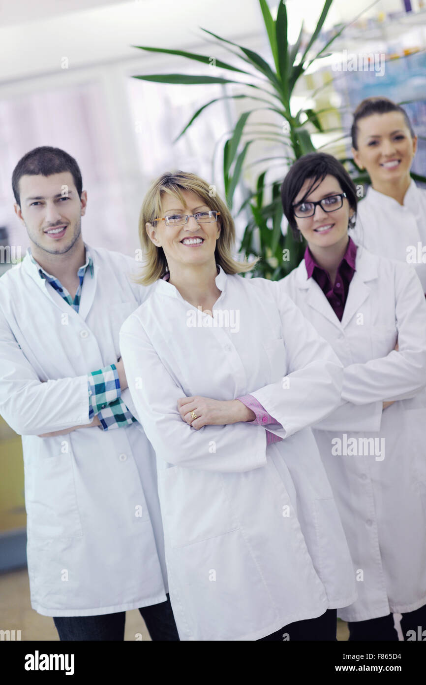 team of pharmacist chemist woman and man group standing in pharmacy ...
