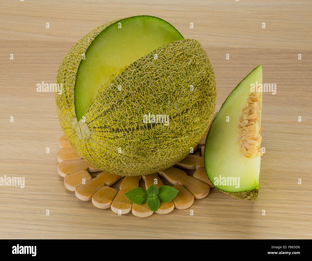Fresh ripe melon sliced on the desk Stock Photo - Alamy
