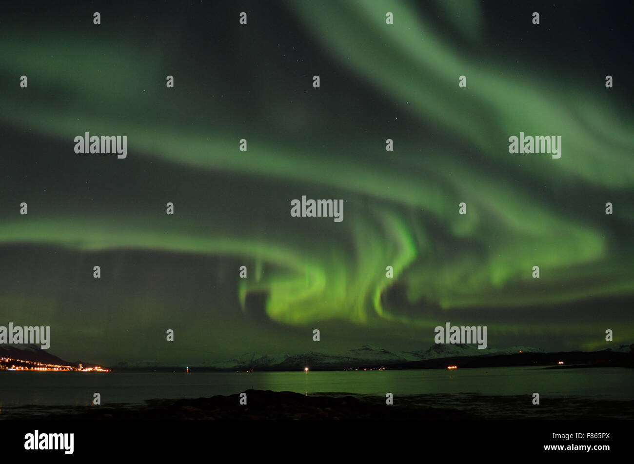 aurora borealis over cold fjord and mighty mountains Stock Photo - Alamy