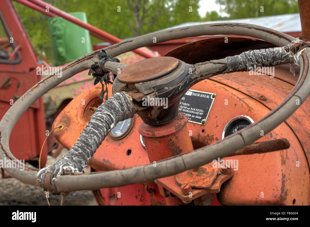 old rusted and weathered tractor steering wheel Stock Photo - Alamy