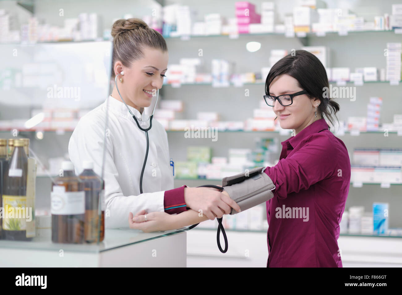 doctor checking blood pressure and heart rate in a hospital or in ...