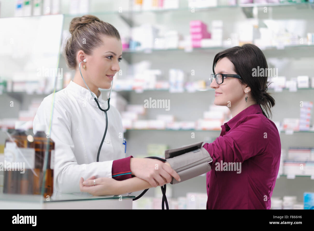 doctor checking blood pressure and heart rate in a hospital or in ...