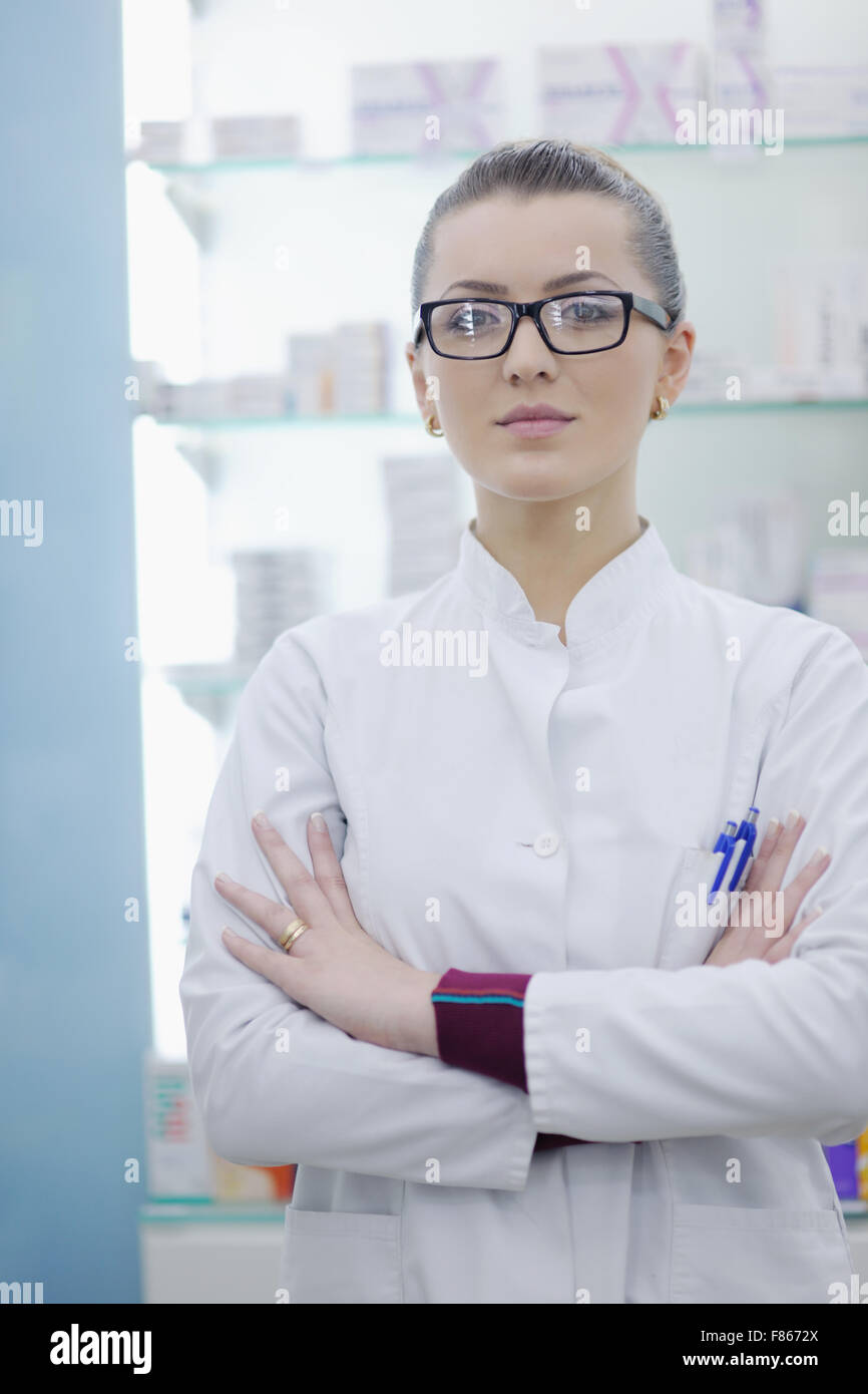 Happy cheerful pharmacist chemist woman standing in pharmacy drugstore ...