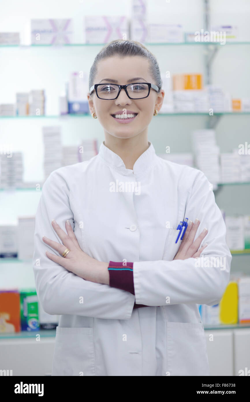 Happy cheerful pharmacist chemist woman standing in pharmacy drugstore ...
