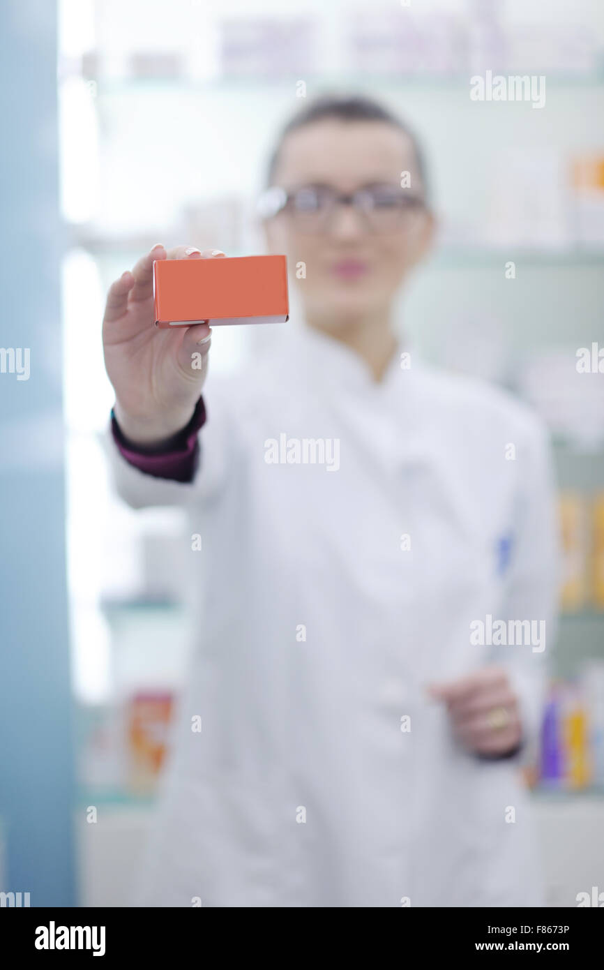 Happy cheerful pharmacist chemist woman standing in pharmacy drugstore ...