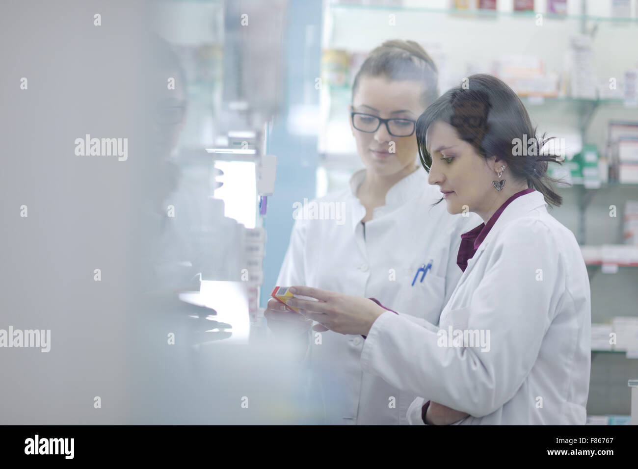 team of pharmacist chemist woman group standing in pharmacy drugstore ...