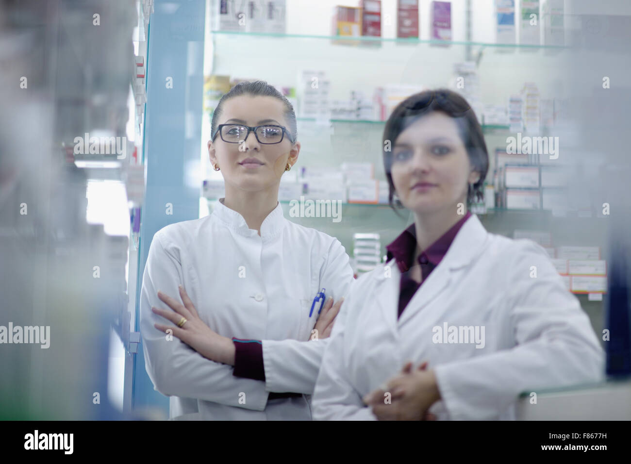 team of pharmacist chemist woman group standing in pharmacy drugstore ...