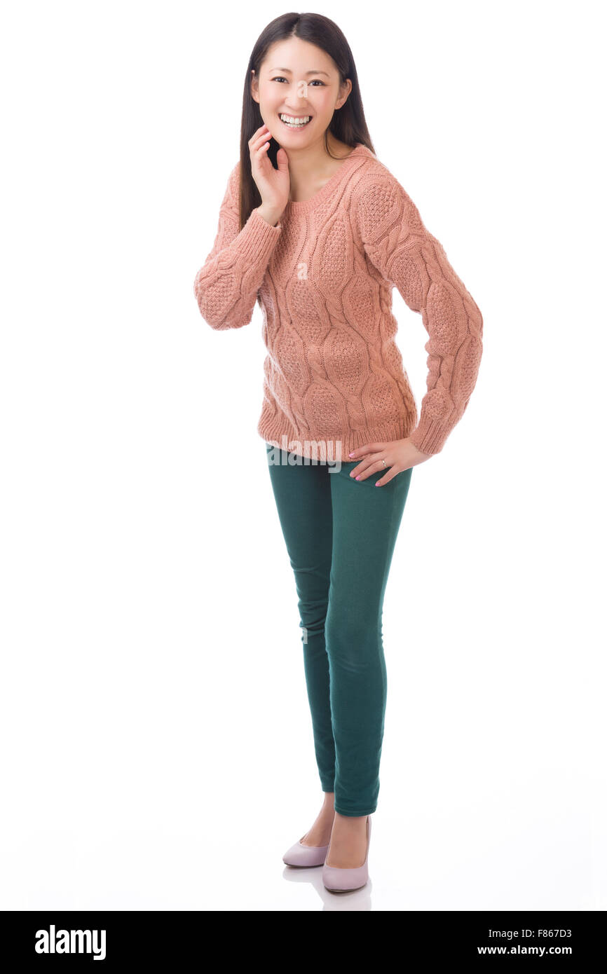 A full body shot of a Japanese woman in hear early 30s on a simple ...