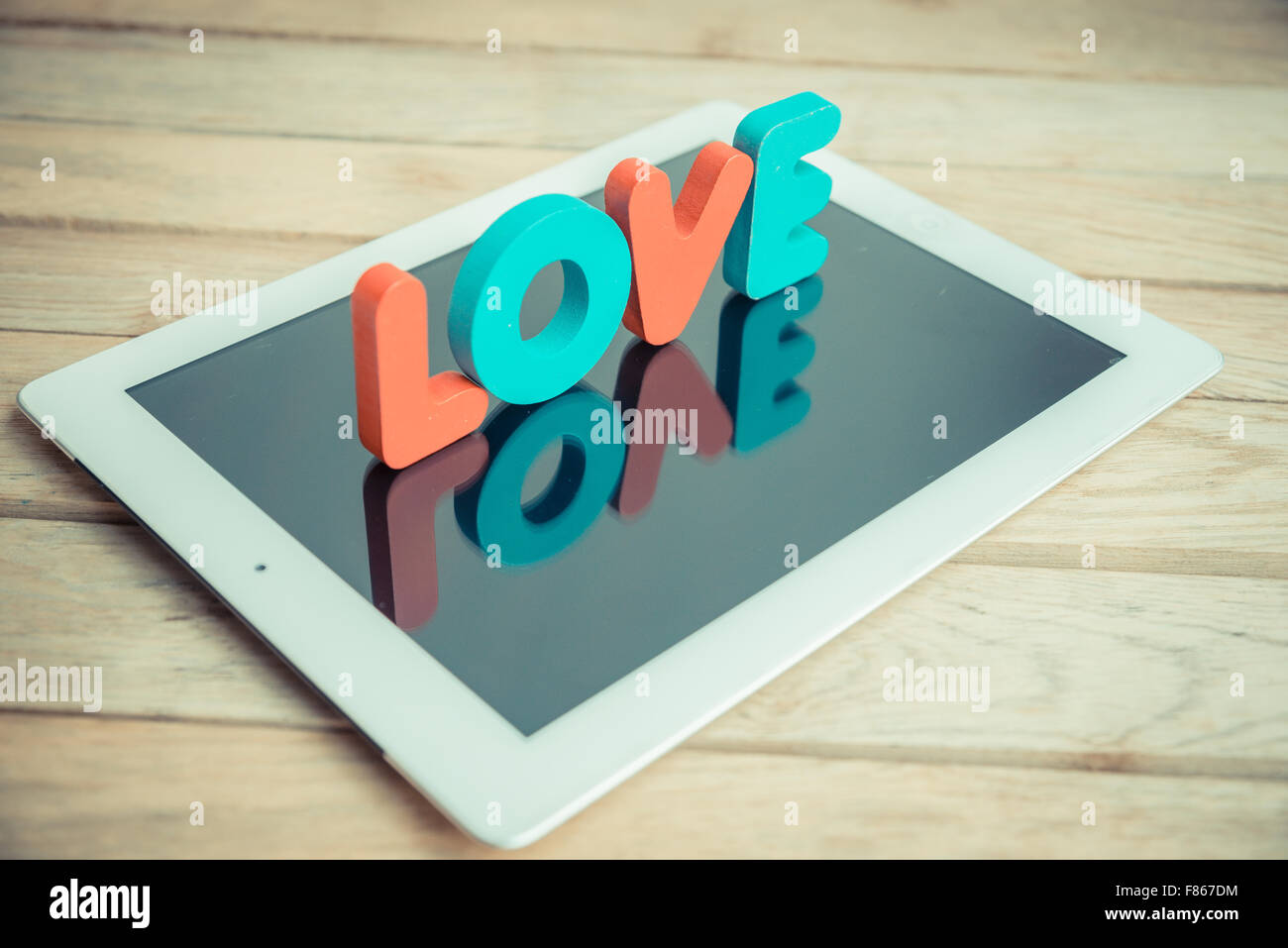 Wooden word LOVE stand on tablet in vintage style 3 Stock Photo - Alamy