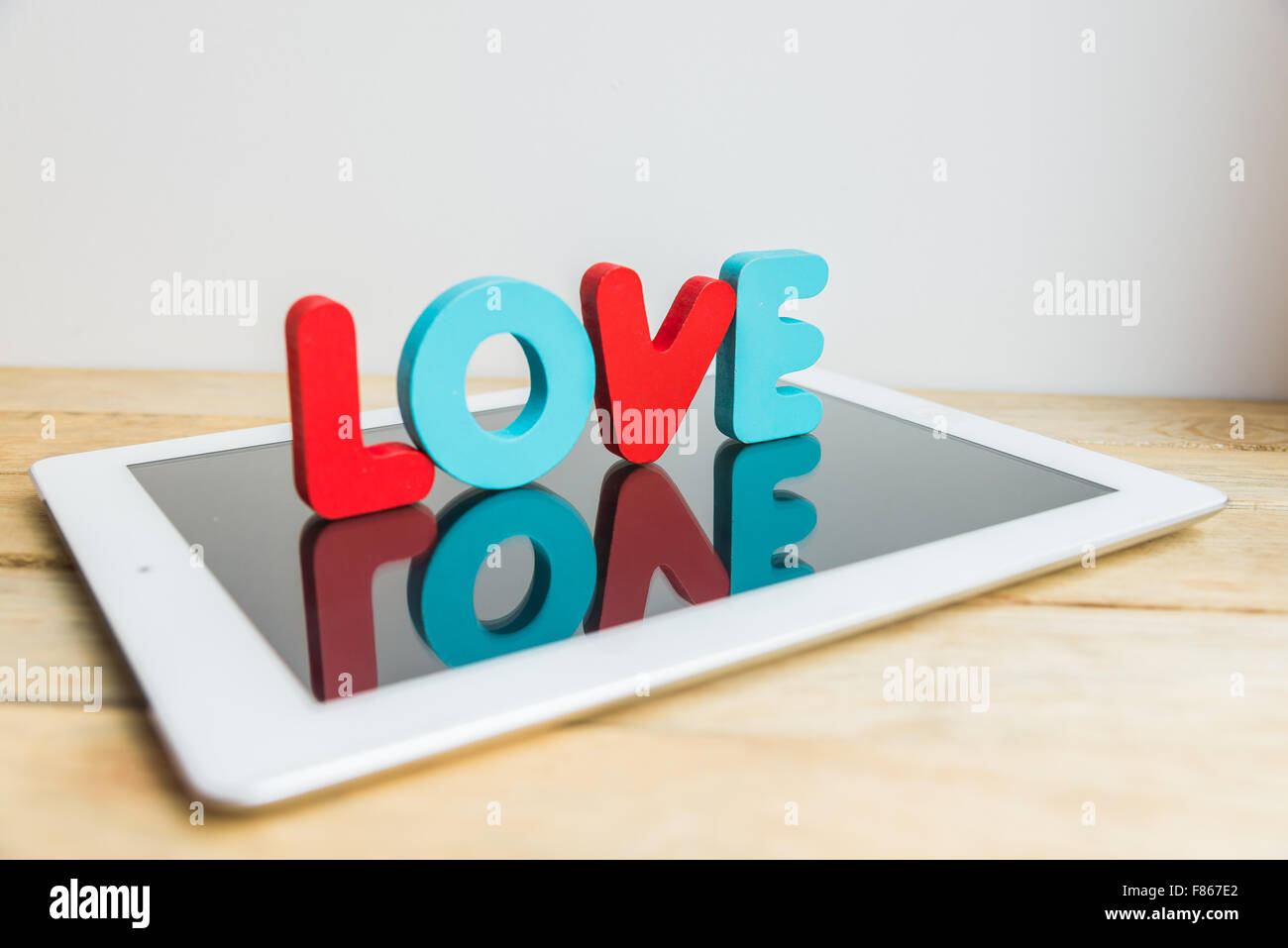 Wooden word LOVE stand on tablet in vintage style 4 Stock Photo - Alamy
