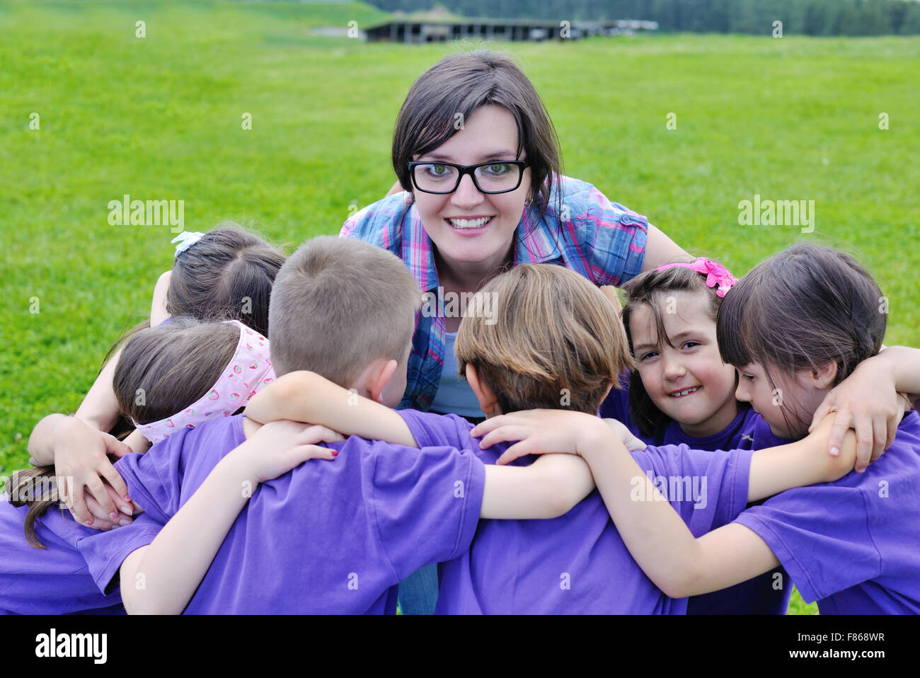 happy preschool kids group have fun and play game on outdoor classes in ...