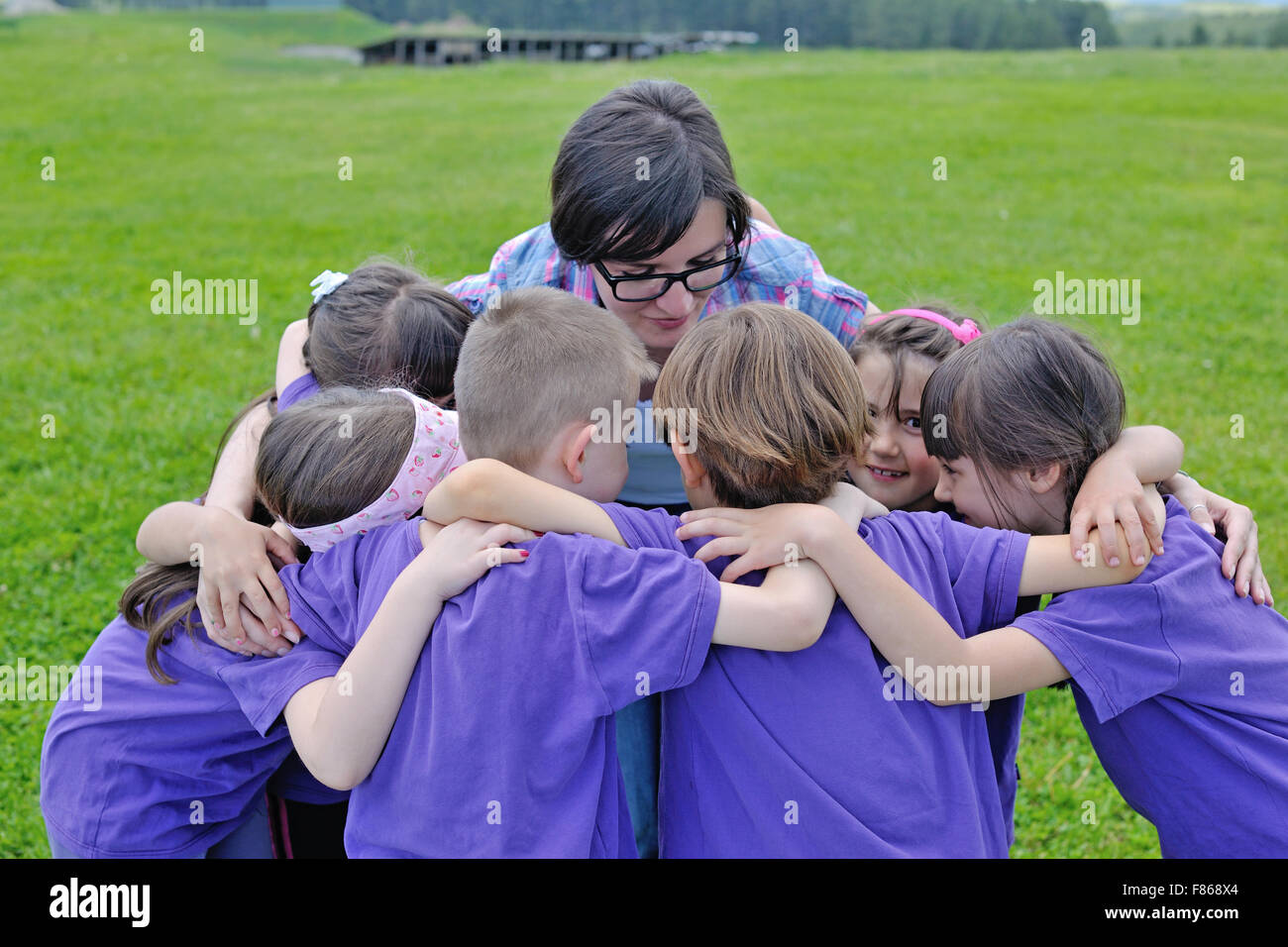 happy preschool kids group have fun and play game on outdoor classes in ...