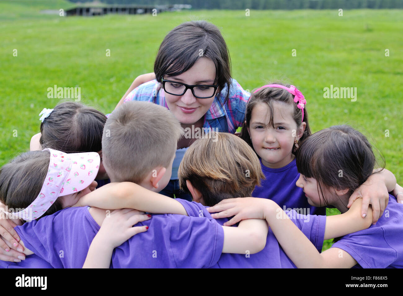 happy preschool kids group have fun and play game on outdoor classes in ...