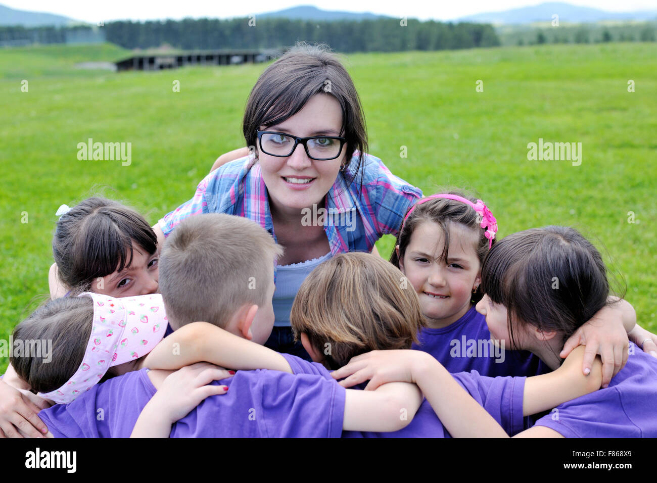 happy preschool kids group have fun and play game on outdoor classes in ...