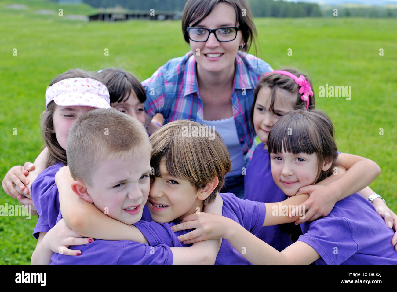 happy preschool kids group have fun and play game on outdoor classes in ...