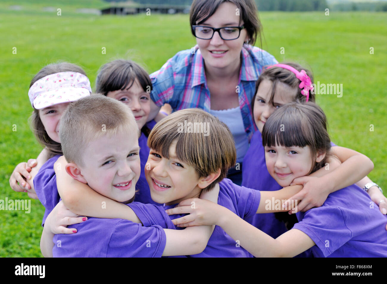 happy preschool kids group have fun and play game on outdoor classes in ...