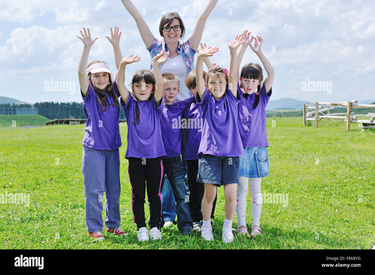 happy preschool kids group have fun and play game on outdoor classes in ...