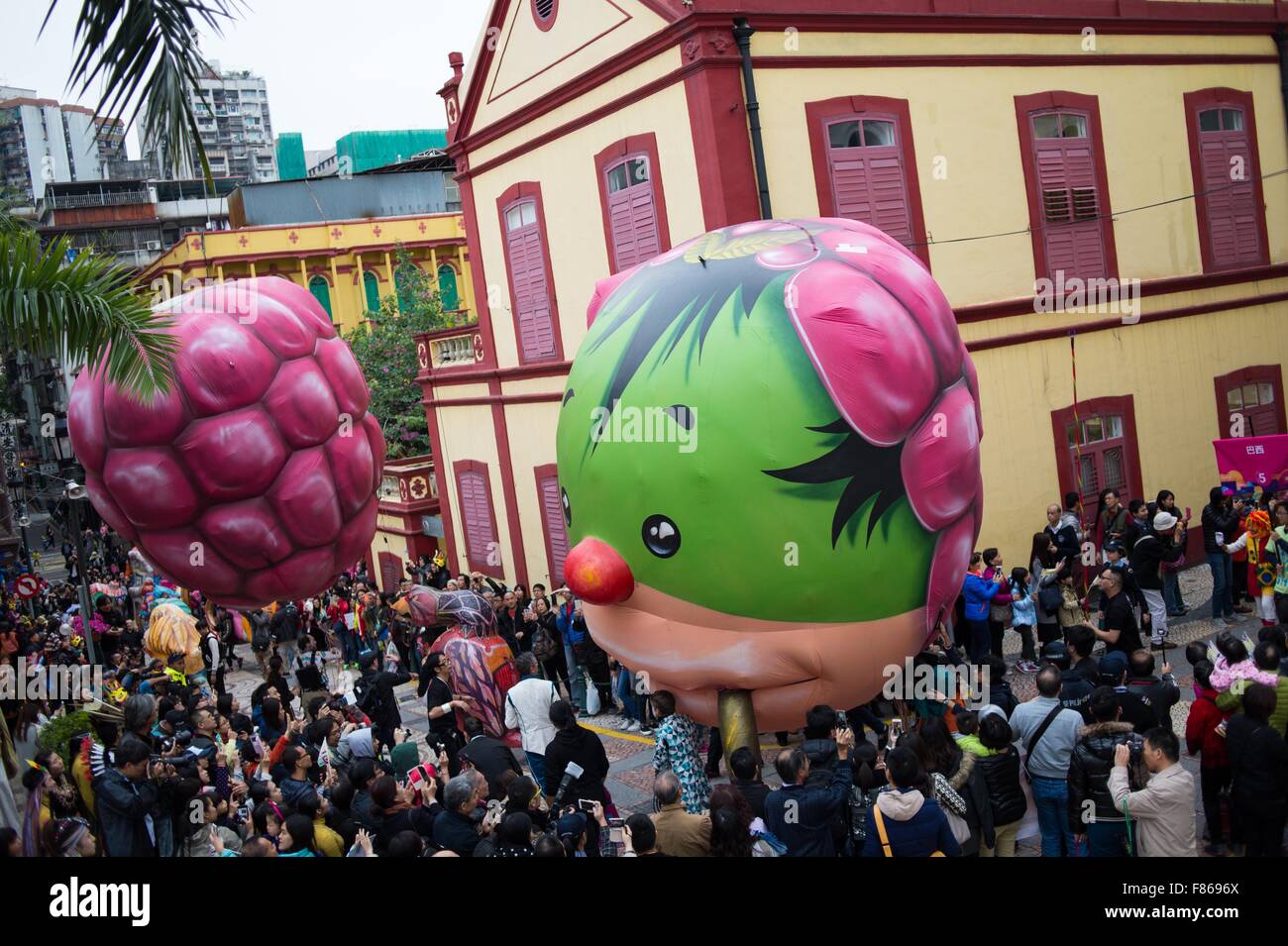 Macao, China. 6th Dec, 2015. People participate in a carnival parade in ...