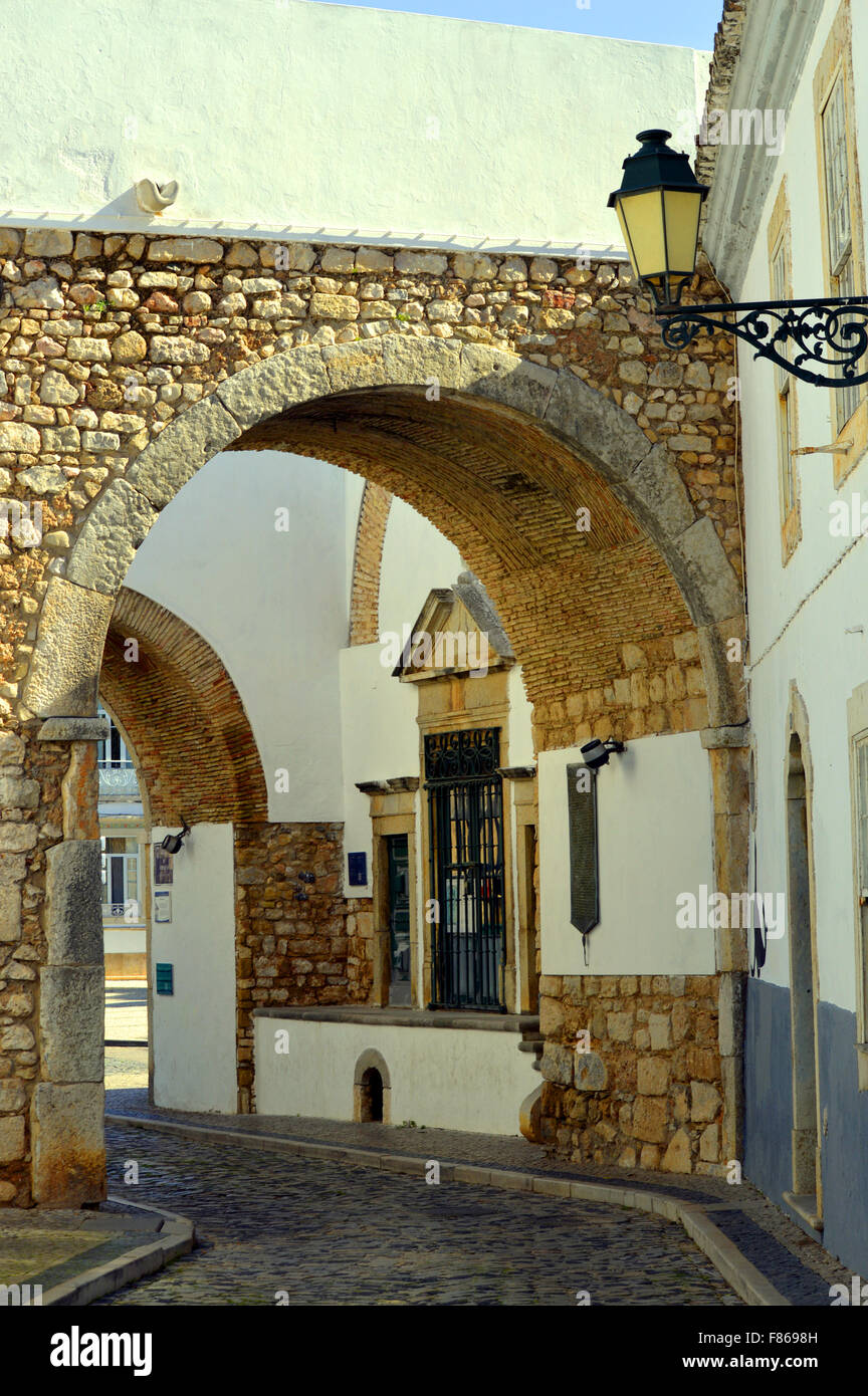 Buildings through stone arch wall hi-res stock photography and images ...