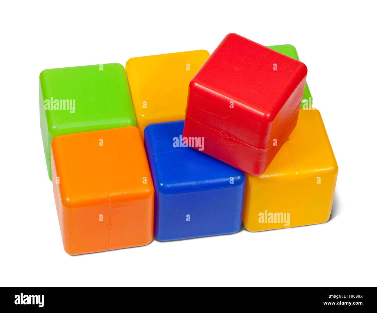 Plastic toy blocks on white background Stock Photo - Alamy