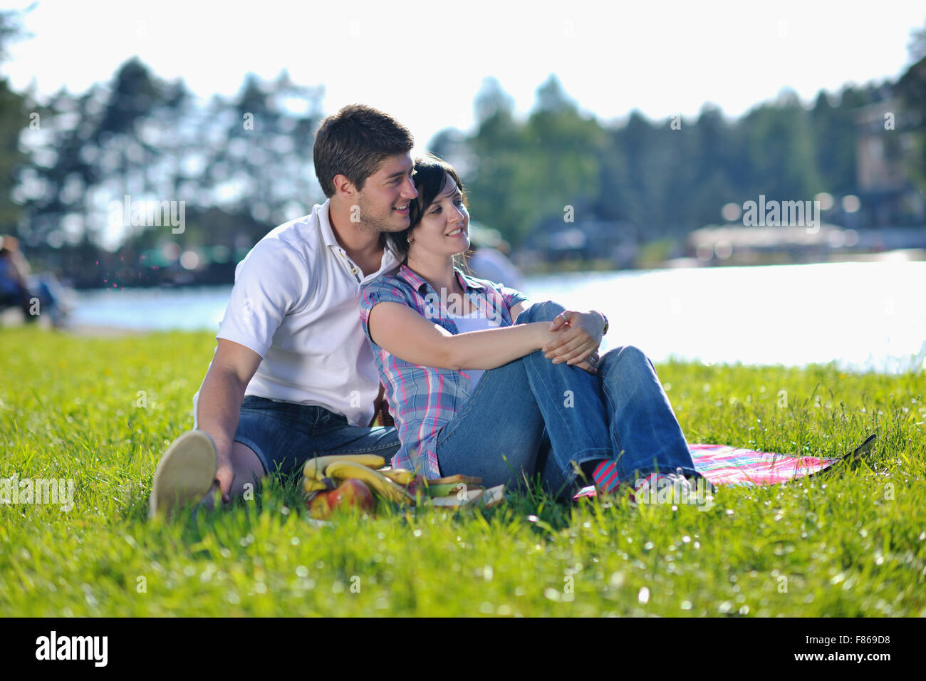 happy young romantic couple in love having a picnic outdoor on a summer ...