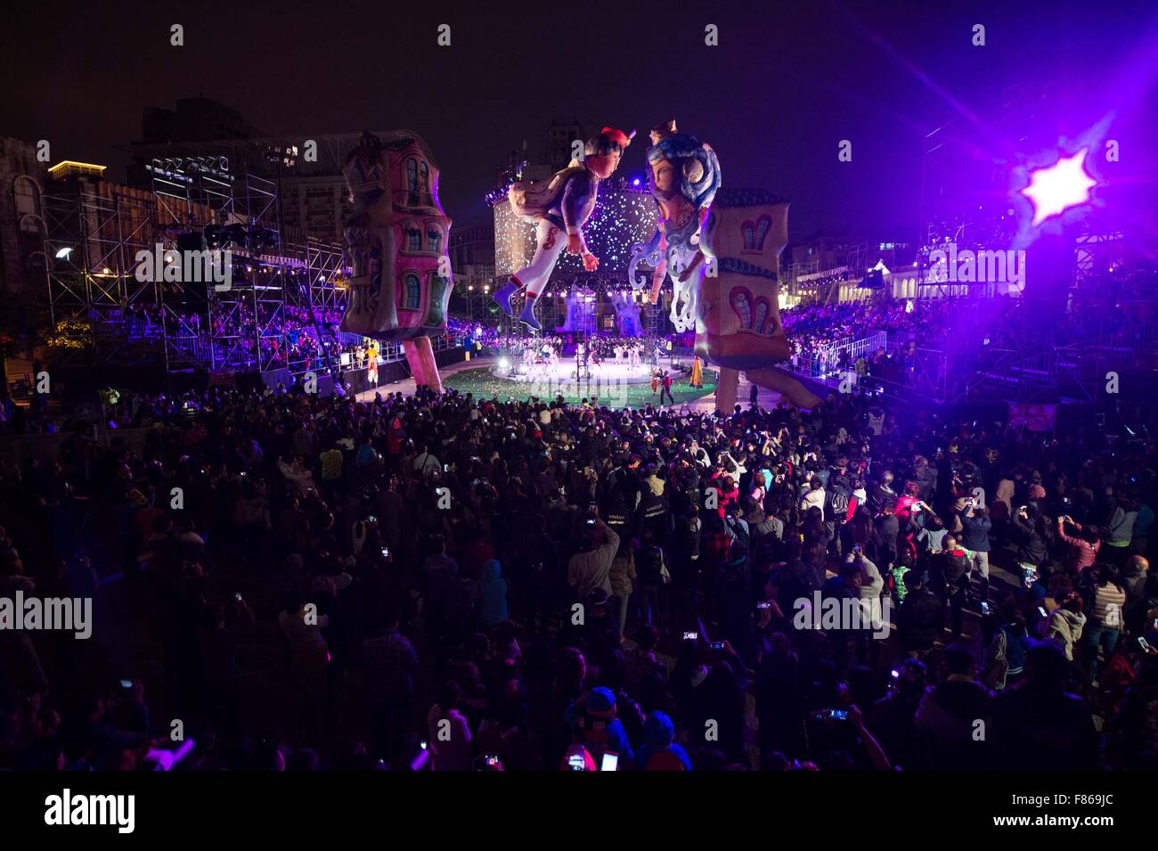 Macao, China. 6th Dec, 2015. People participate in a carnival parade in ...