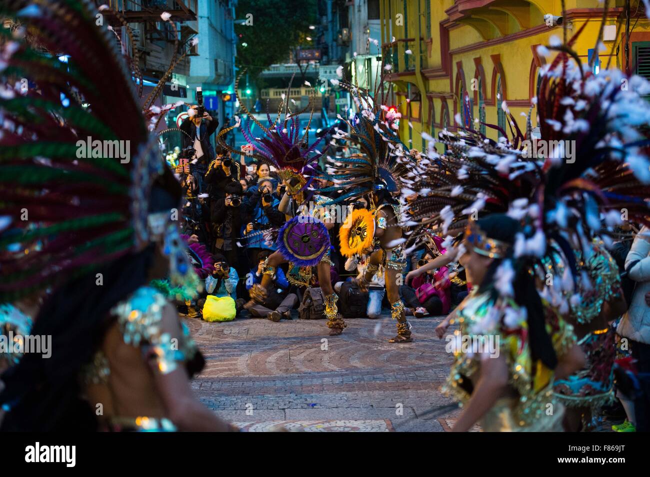 Macao, China. 6th Dec, 2015. Participants perform during a carnival ...