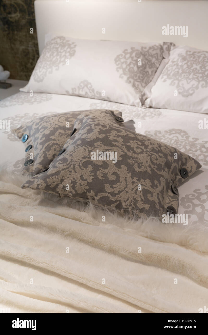 Luxury bed with decorated sheets and a warm blanket Stock Photo - Alamy