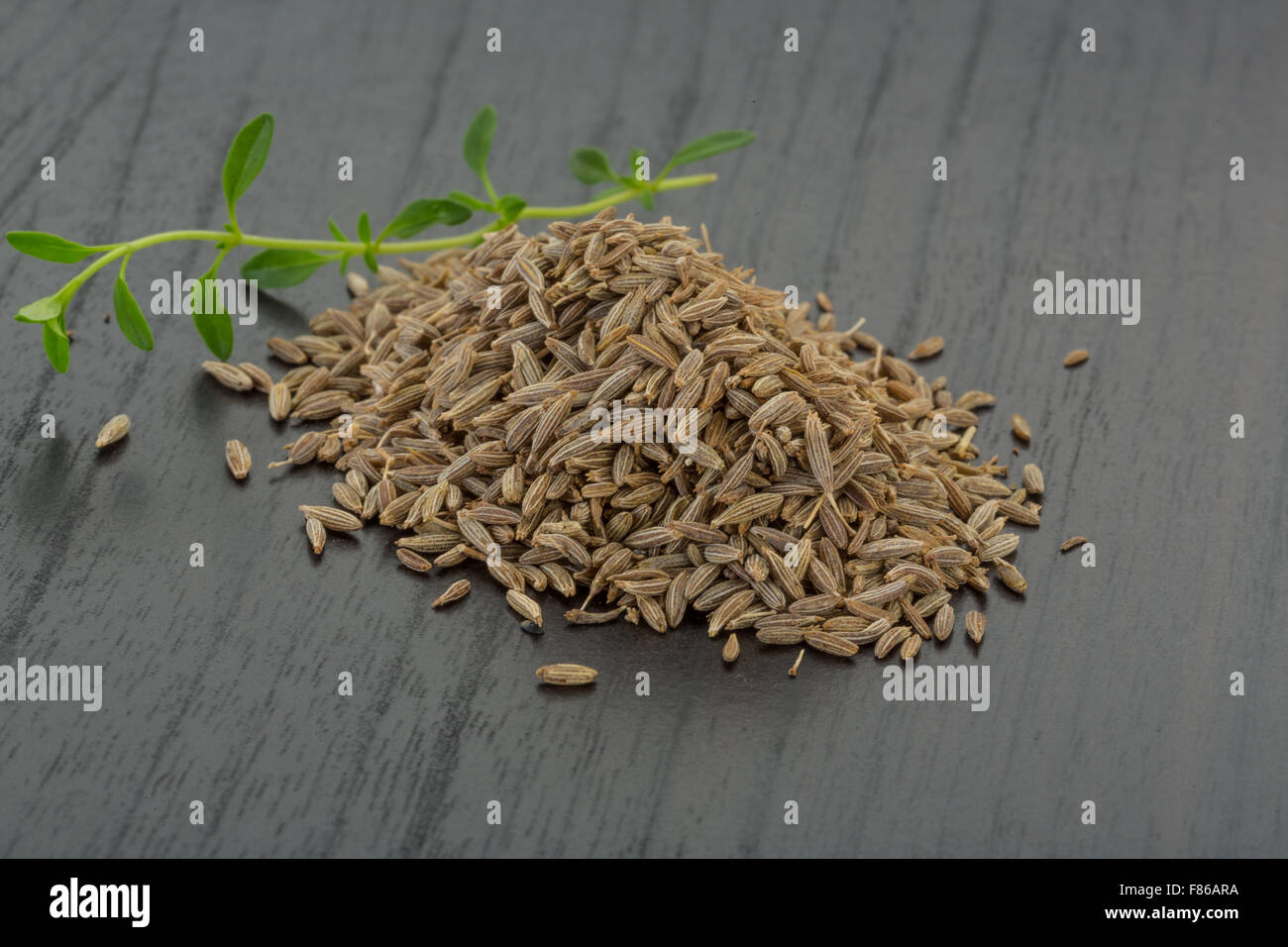 Zira seeds heap on the desk Stock Photo - Alamy