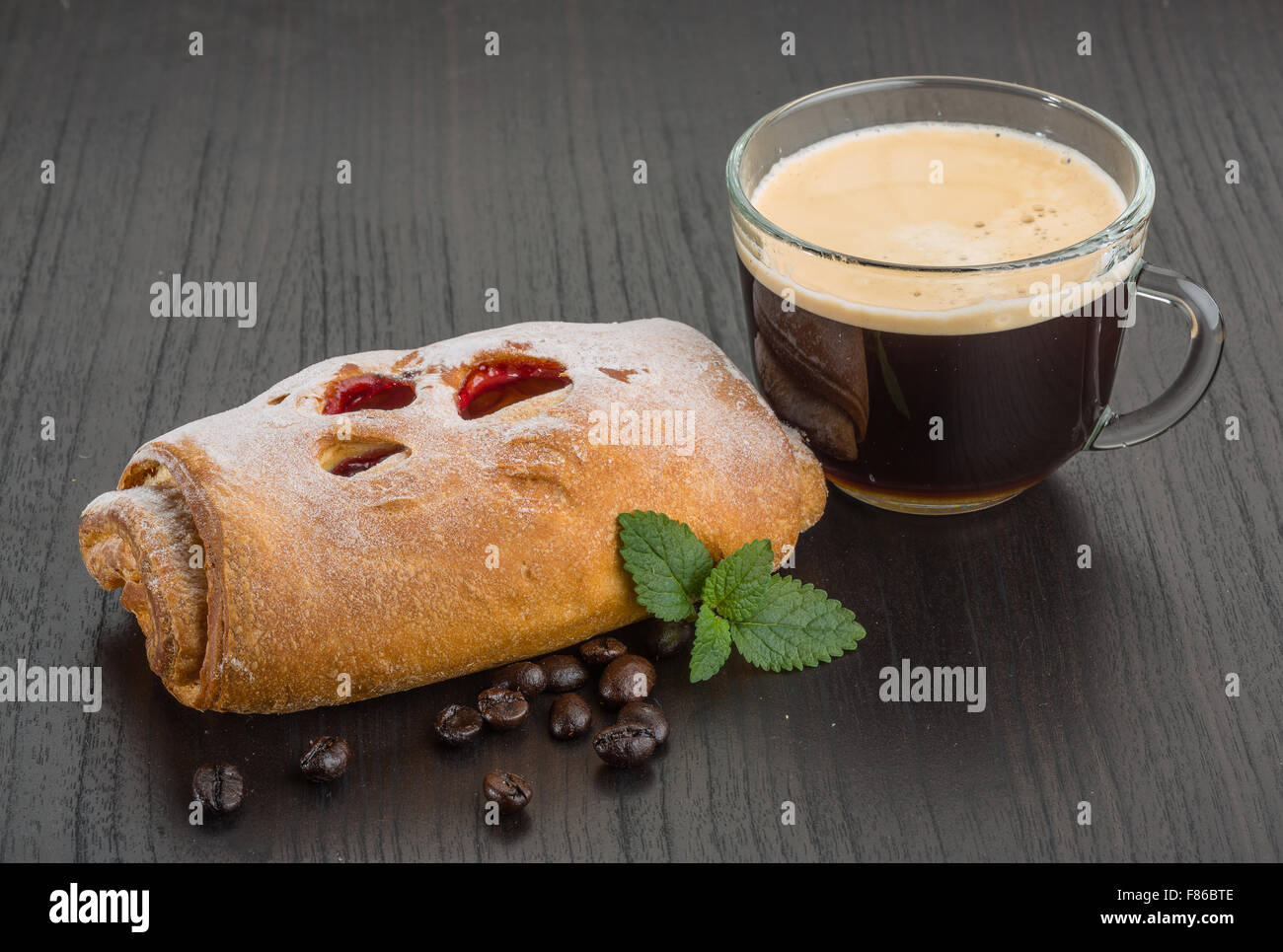 Coffee with bun and mint Stock Photo - Alamy