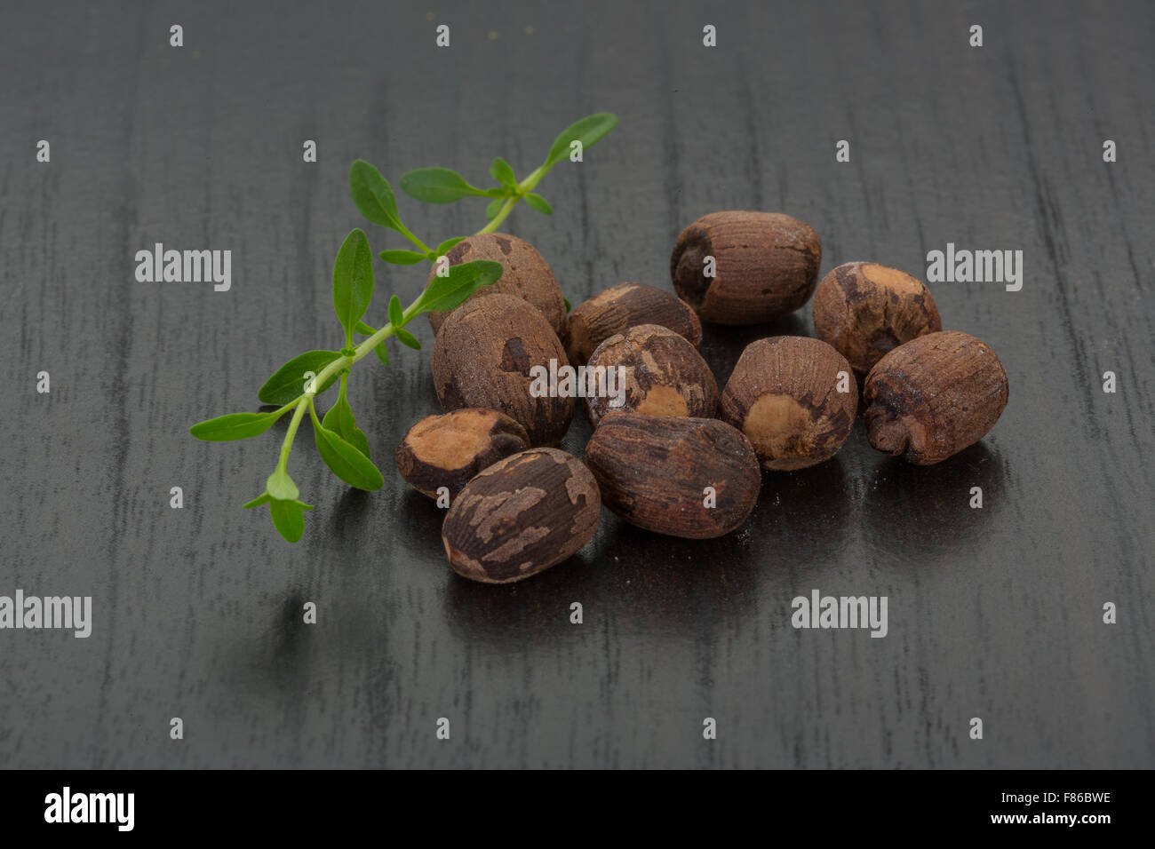 Small nutmeg on the desk Stock Photo - Alamy