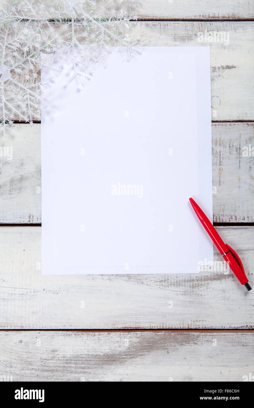 The blank sheet of paper on the wooden table with a pen Stock Photo - Alamy