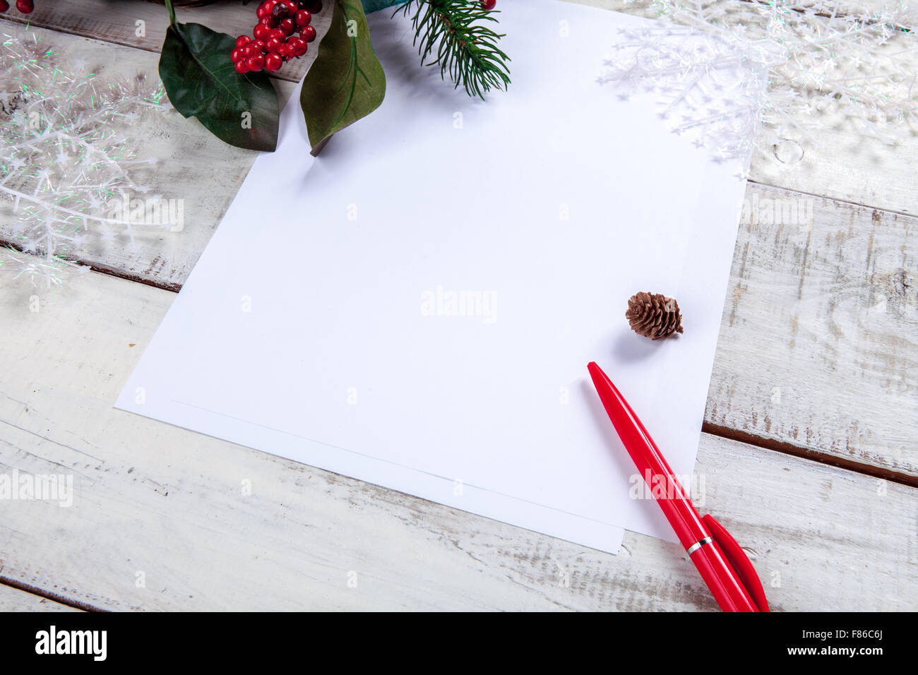 The blank sheet of paper on the wooden table with a pen Stock Photo - Alamy