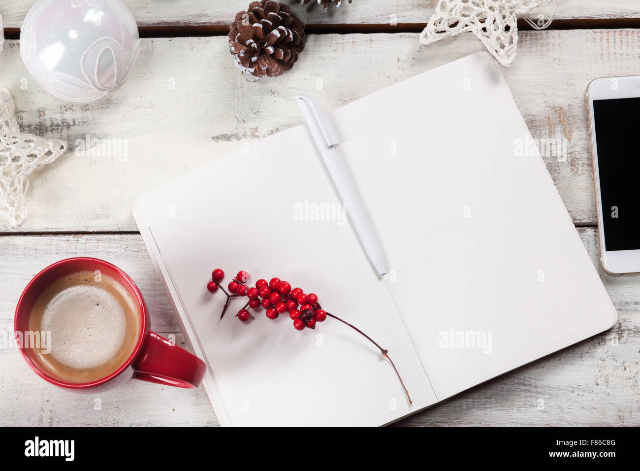 The open notebook on the wooden table with a phone Stock Photo - Alamy