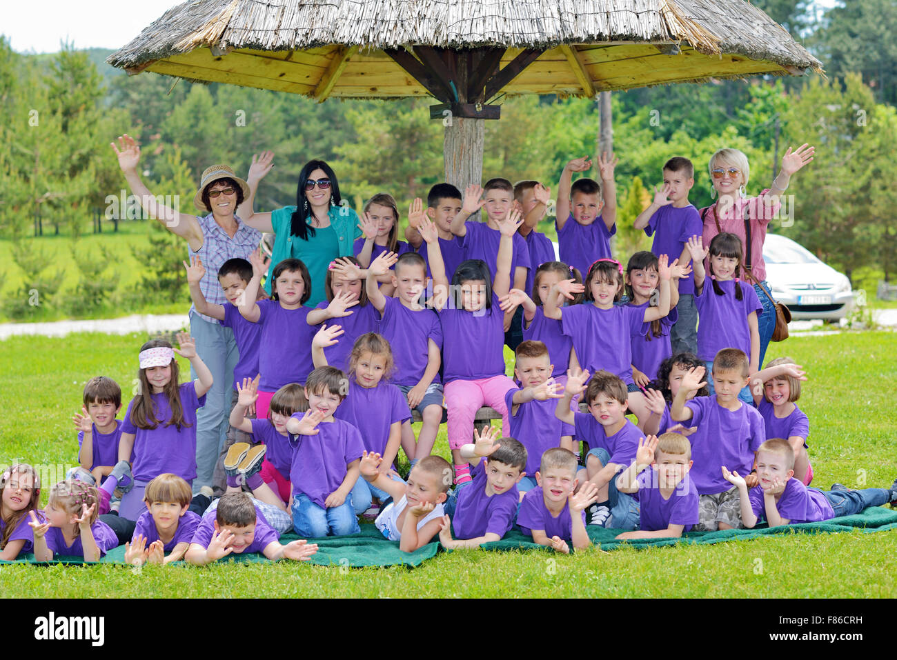 happy preschool kids group have fun and play game on outdoor classes in ...