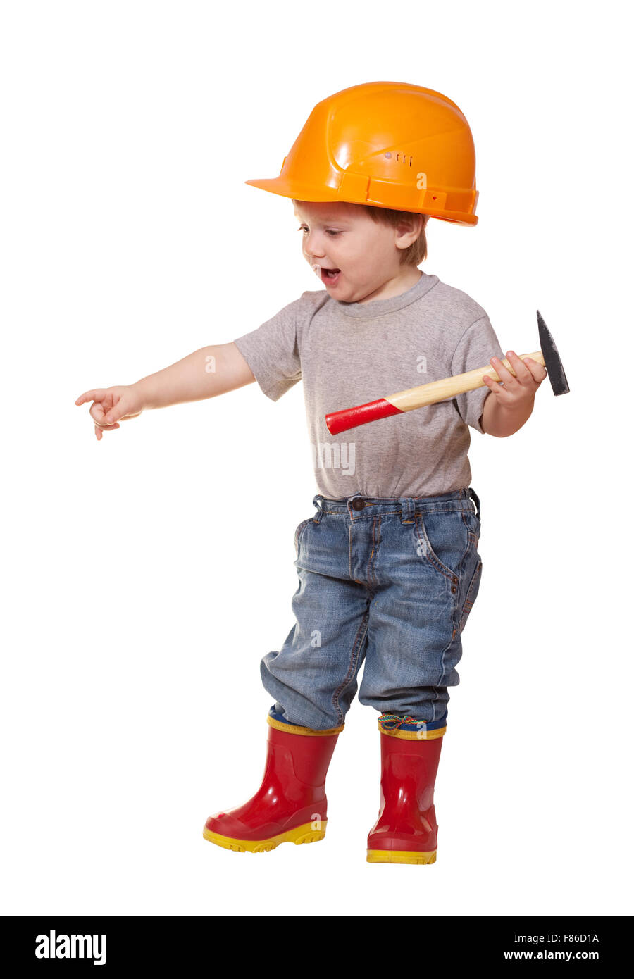 Toddler in hardhat with hammer. Isolated over white background with ...