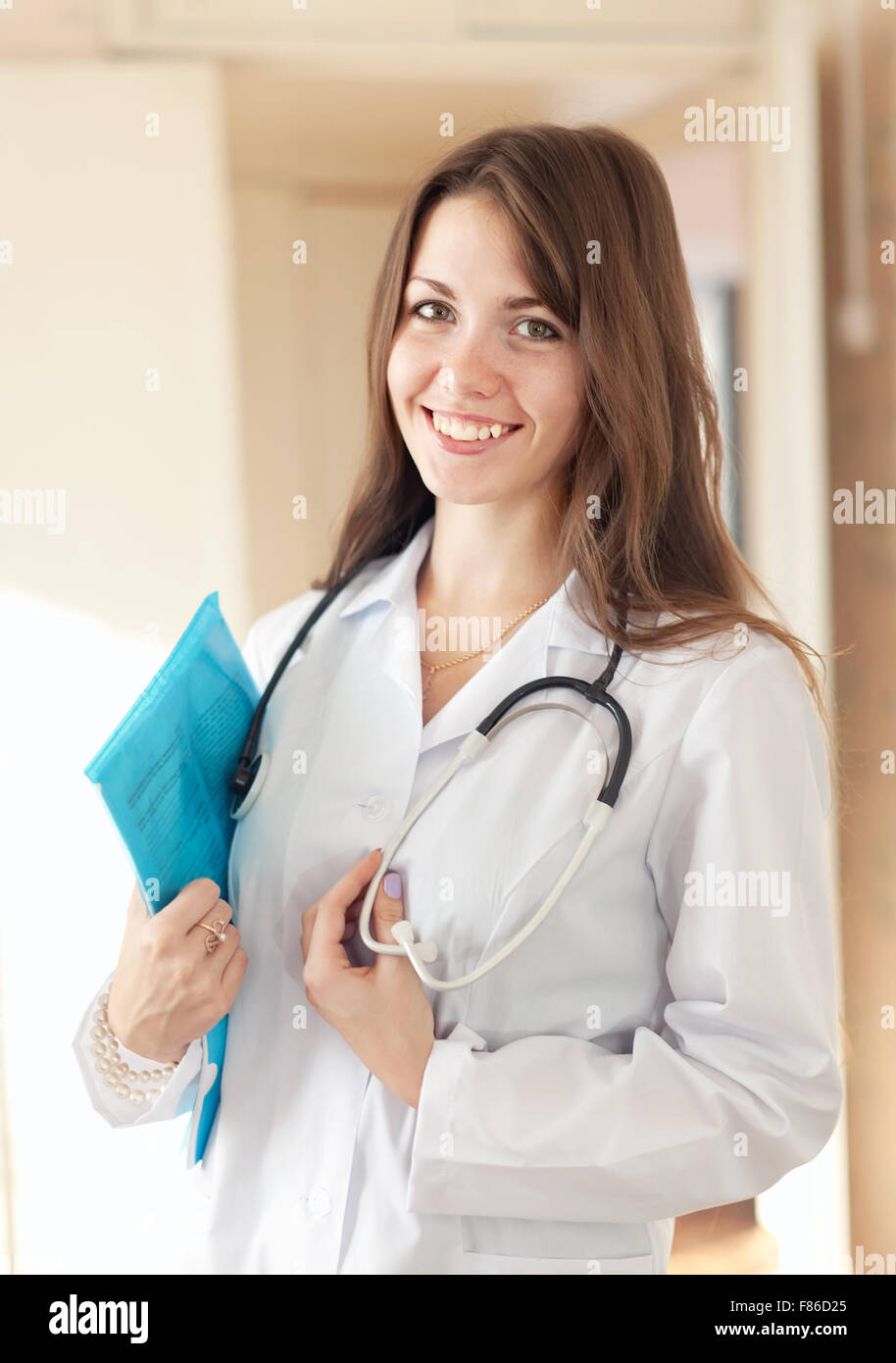 Portrait of friendly doctor in clinic interior Stock Photo - Alamy