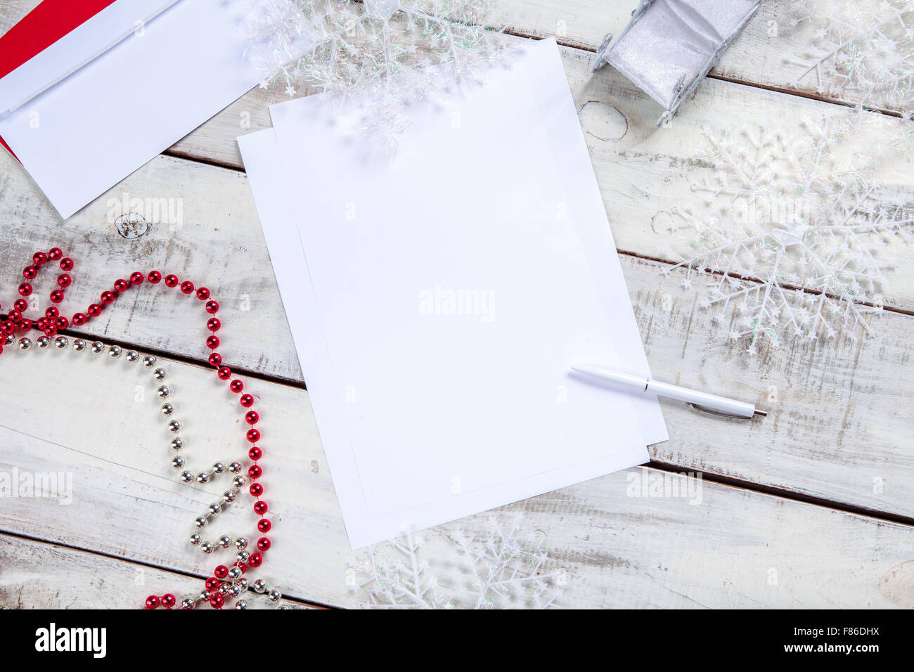 The blank sheet of paper on the wooden table with a pen Stock Photo - Alamy