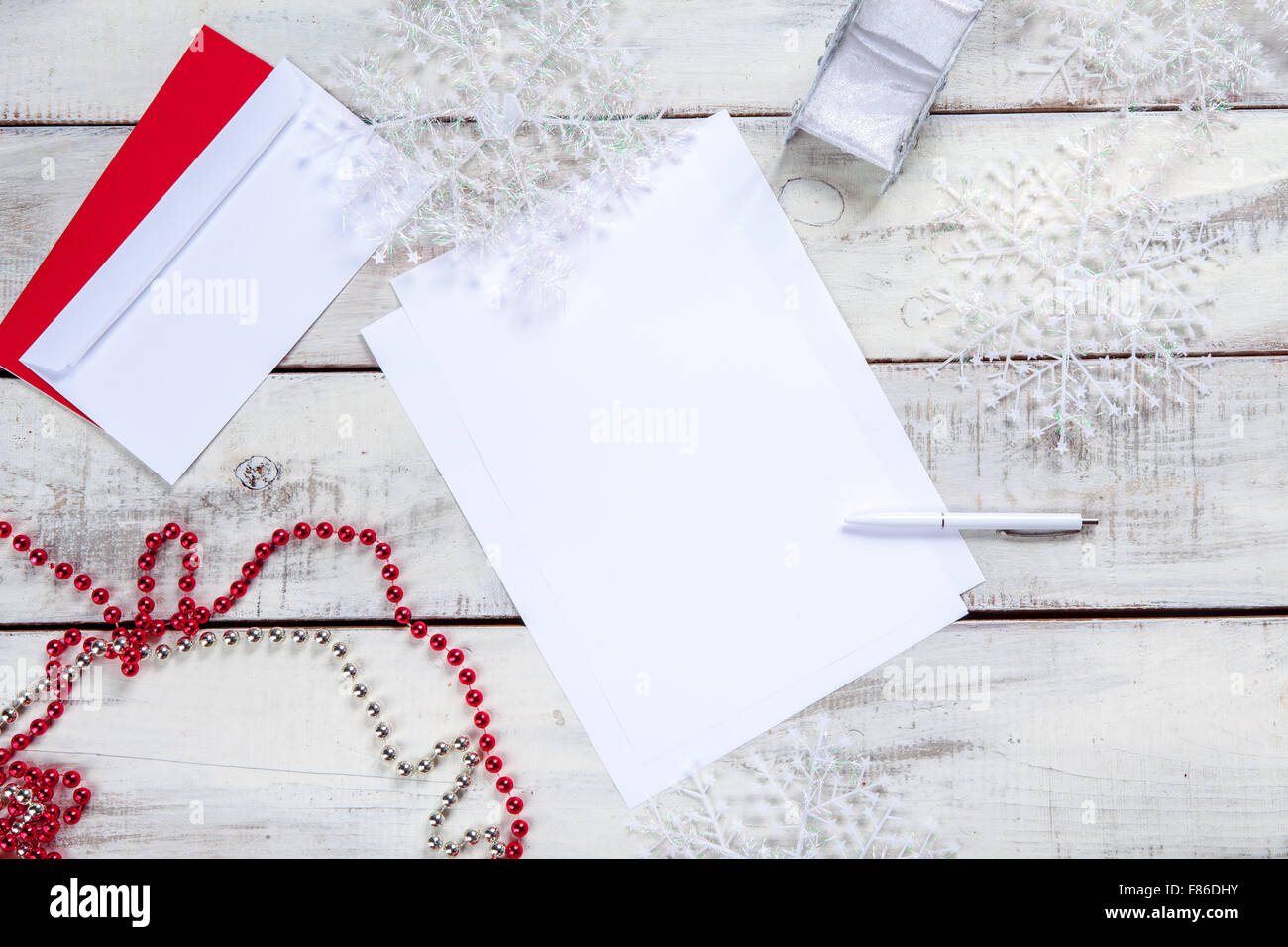 The blank sheet of paper on the wooden table with a pen Stock Photo - Alamy