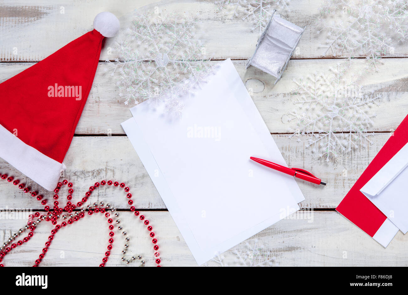 The blank sheet of paper on the wooden table with a pen Stock Photo - Alamy