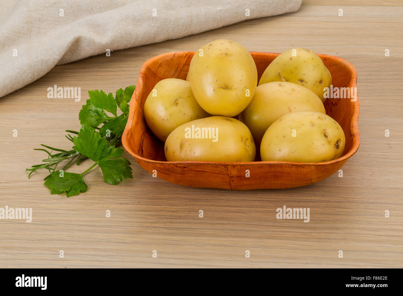 New season Raw potatoes on the desk Stock Photo - Alamy