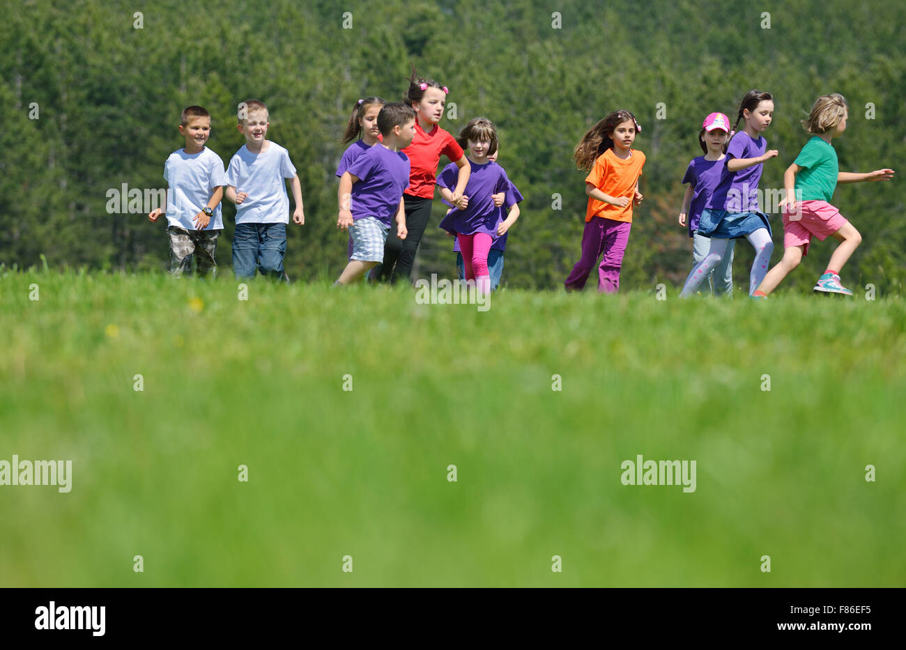 happy kids group have fun in nature outdoors park Stock Photo - Alamy