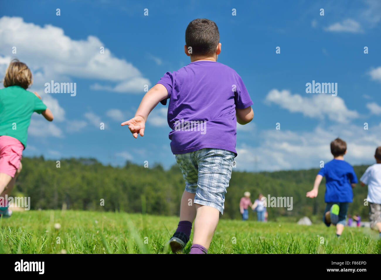 happy kids group have fun in nature outdoors park Stock Photo - Alamy